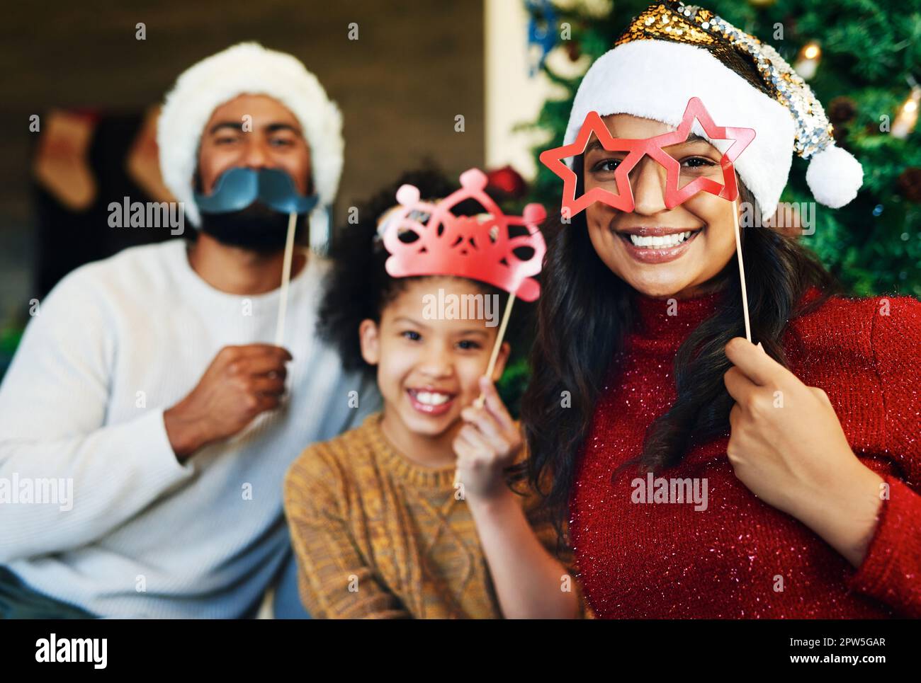 Christmas, props and portrait of girl with family celebration with ...