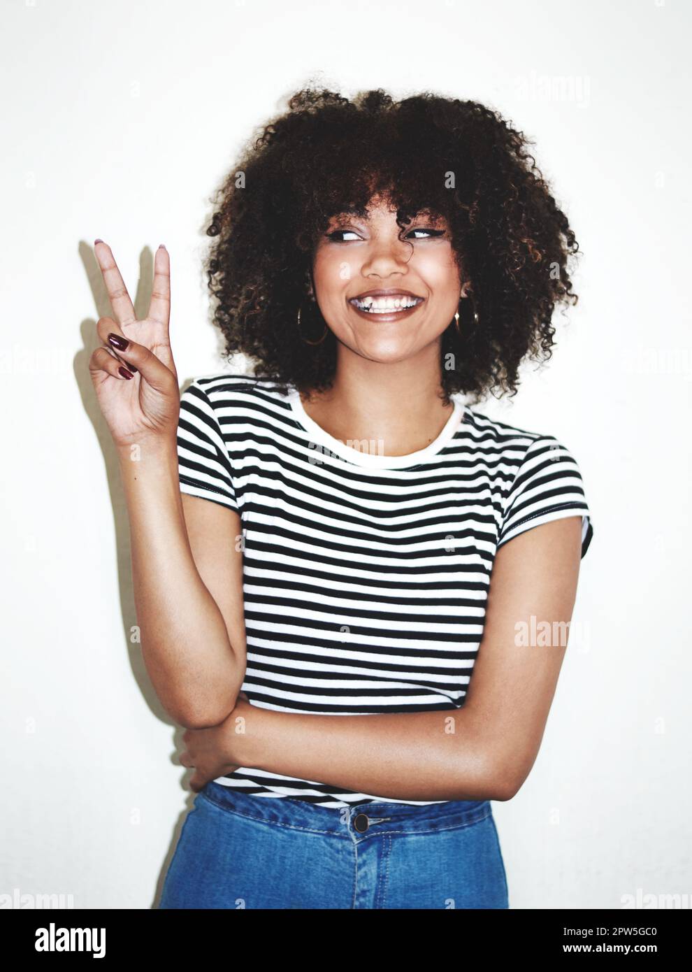 Peace, sign and black woman with smile, excited and casual against a ...