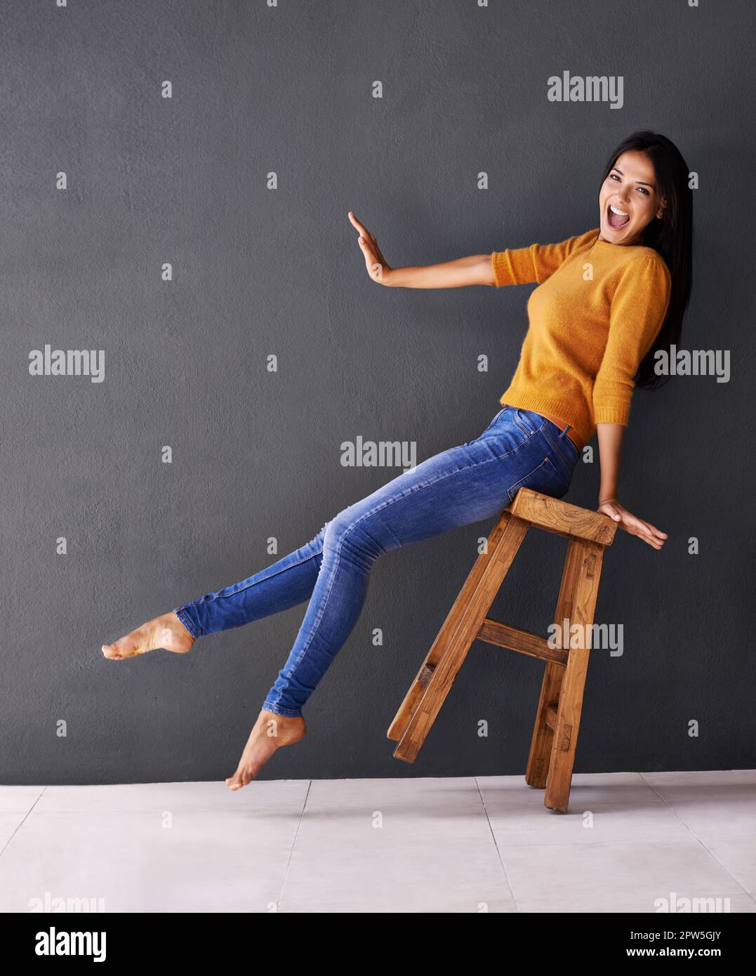 Woman standing on a stool hi-res stock photography and images - Alamy