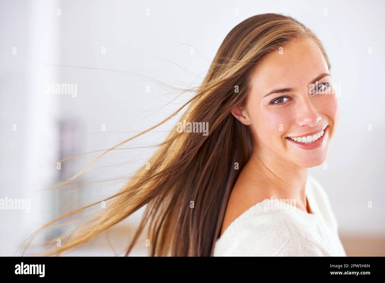 Flashing you a perfect smile. Portrait of an attractive young woman ...
