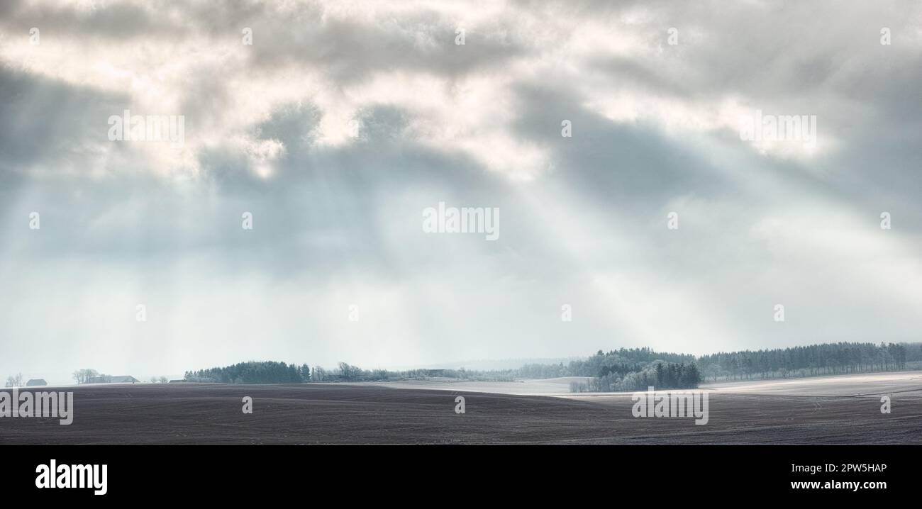 Sunbeams breaking through the clouds. Sunbeams breaking through the ...