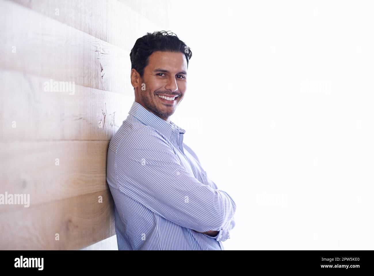 Indian business man standing against wall hi-res stock photography and ...