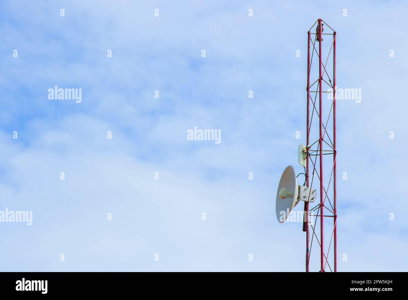 Mobile phone communication tower transmission signal with blue sky ...