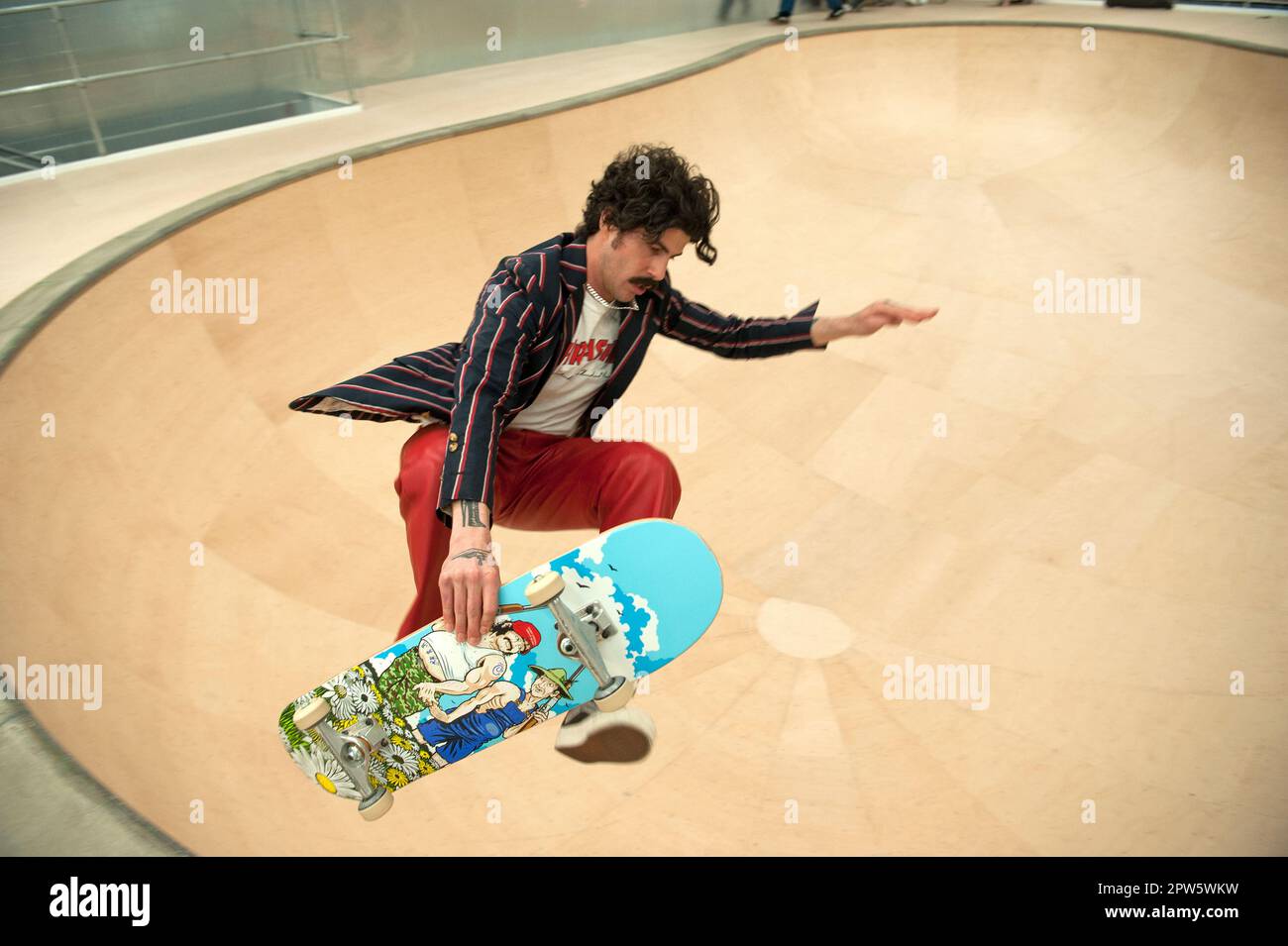 People skateboarding at a custom bowl built inside the Supreme brand ...
