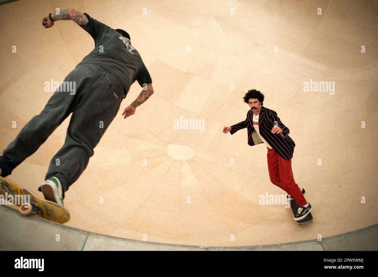 People skateboarding at a custom bowl built inside the Supreme brand ...