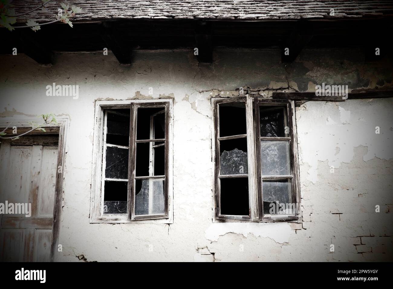 Abandoned spooky old house. Wooden windows and doors. The hut is a mud ...