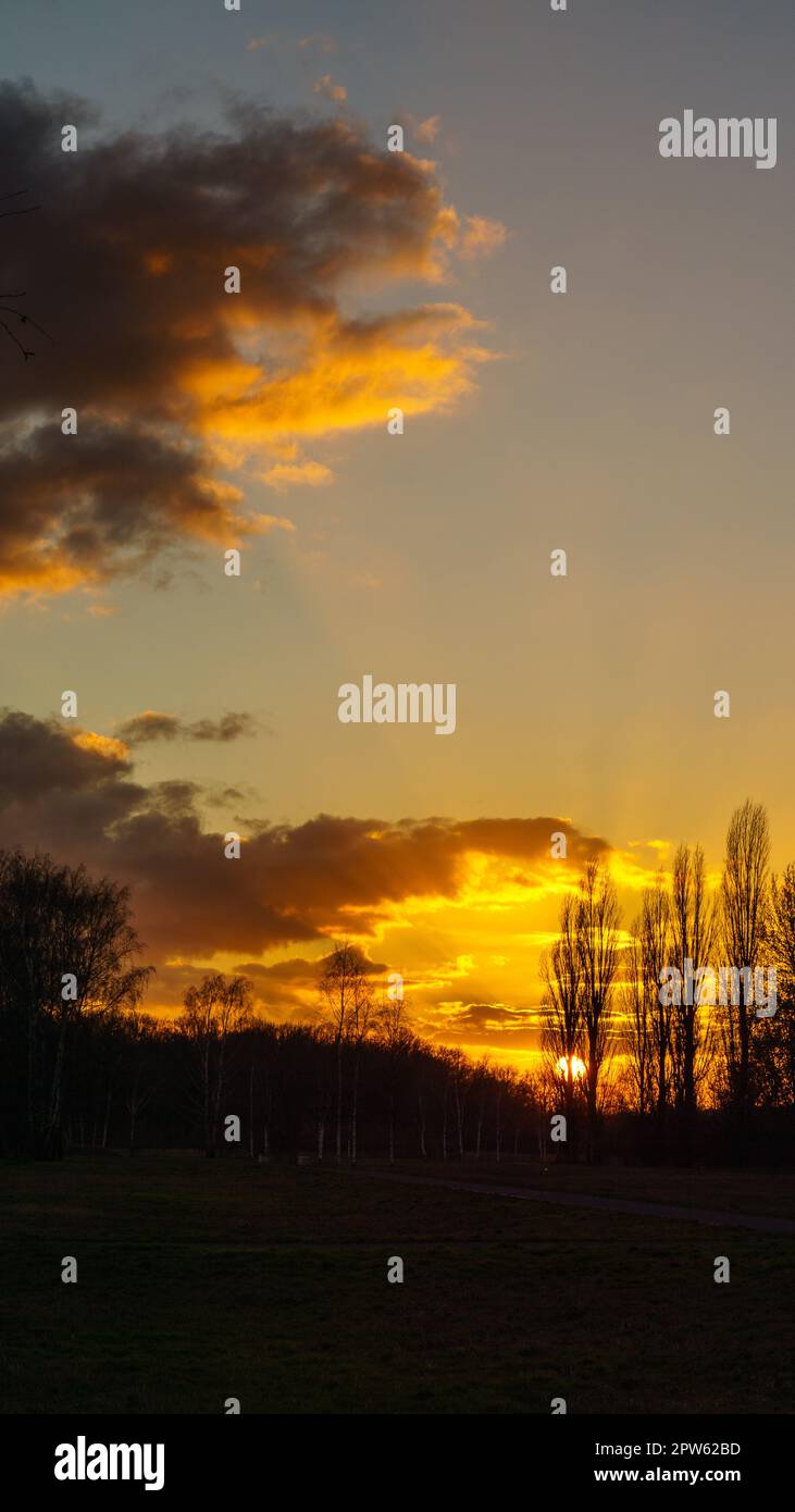 Setting sun on the outskirts of Berlin. The sky seems to burn. Romantic ...