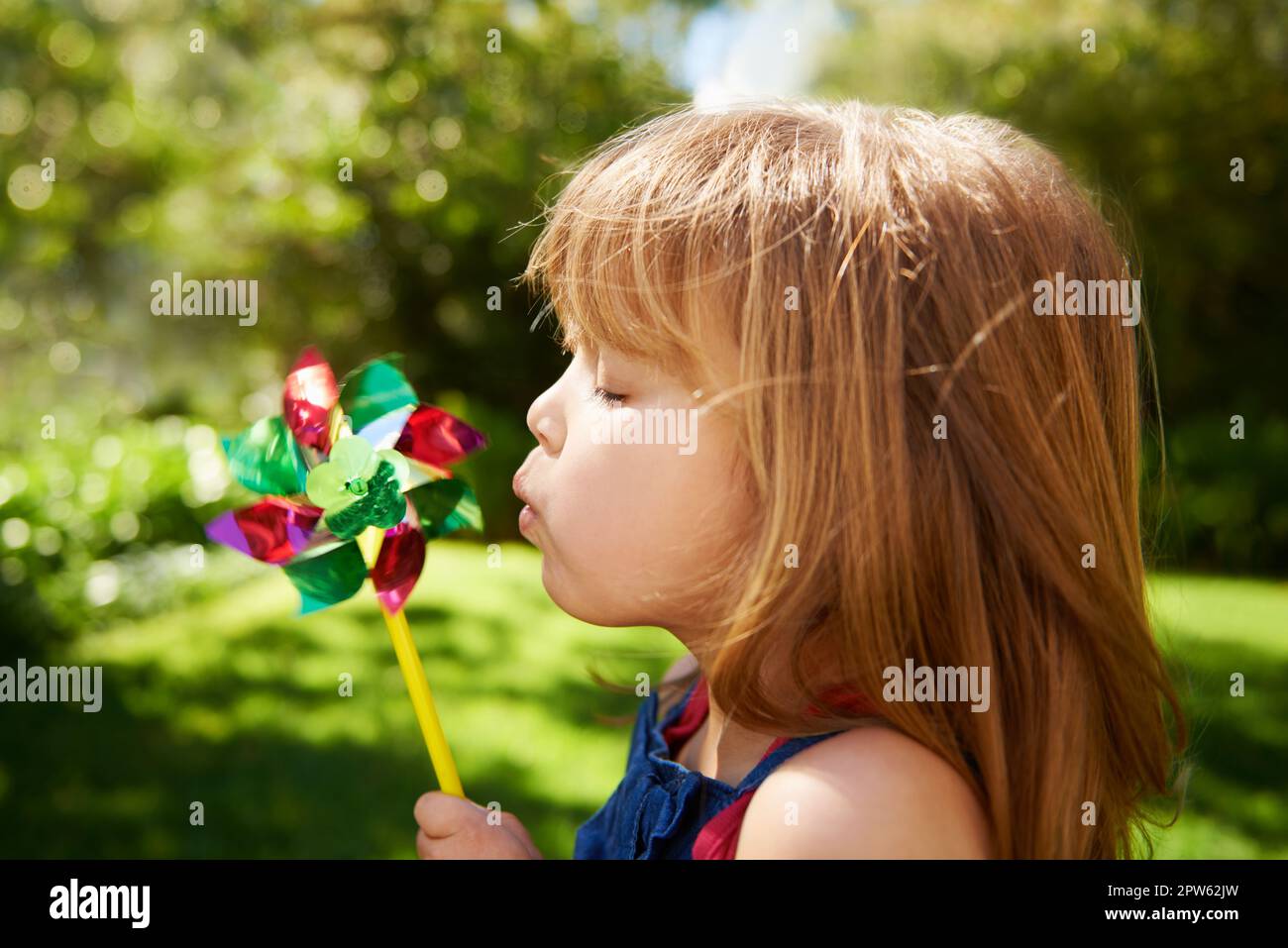 All i need to have fun...a cute little girl playing with a pinwheel ...