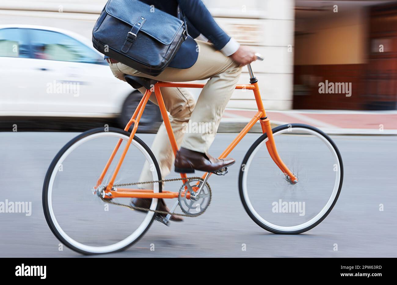 Carbon-free commuting. a man riding his bicycle through the city Stock ...