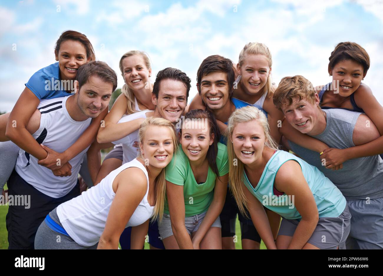 Achieving unity through a team-building exercise. A group of young ...