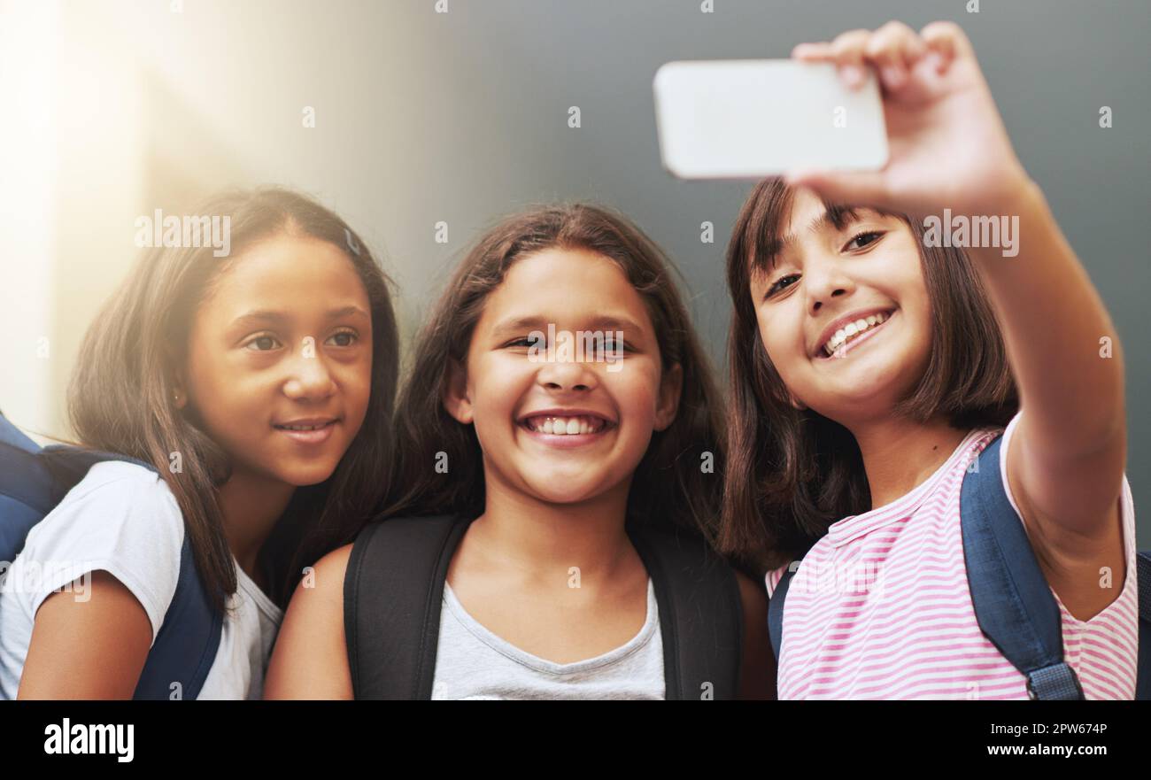 Happy school kids taking selfie hi-res stock photography and images - Alamy