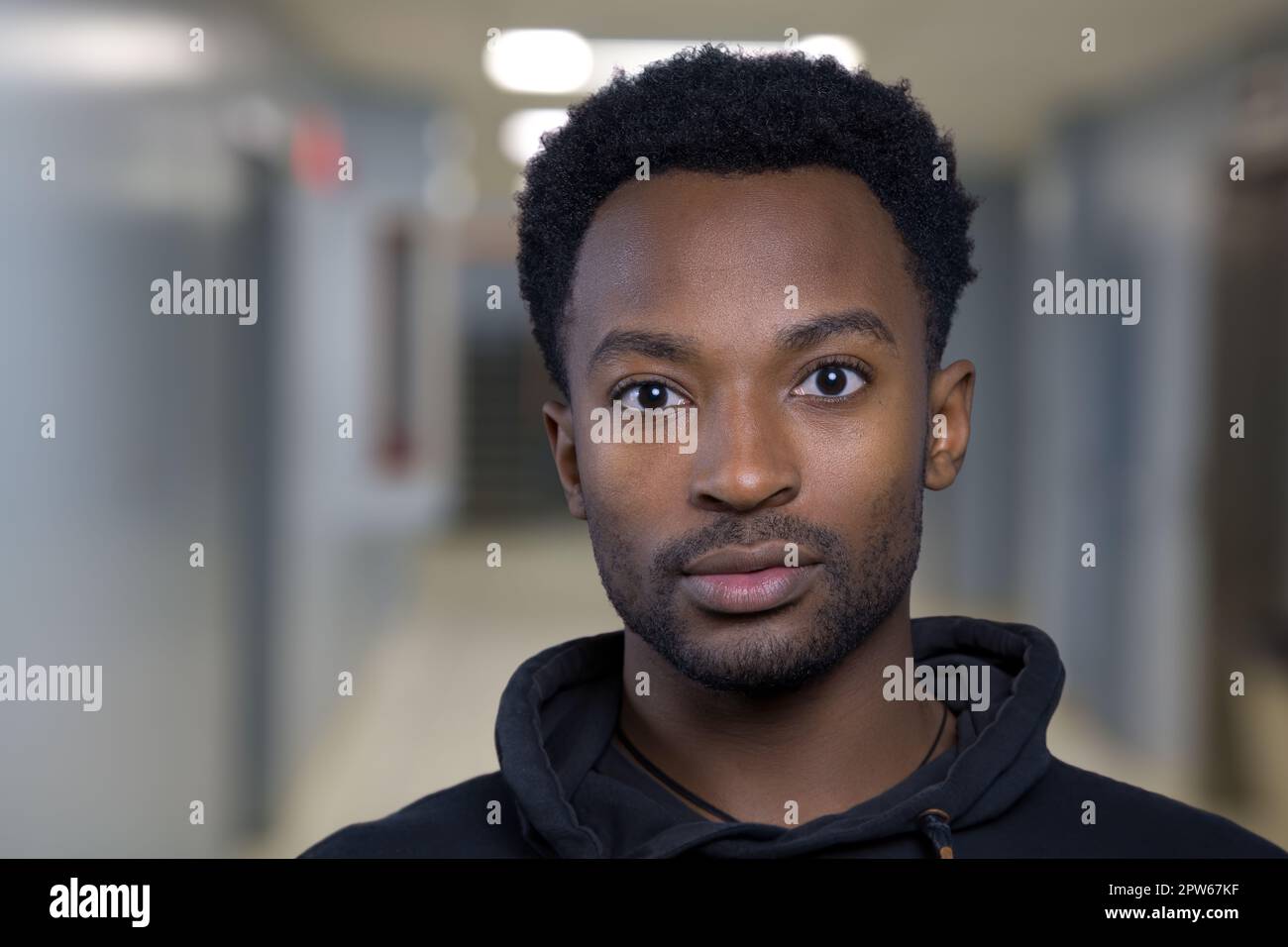 man at university corridor education student at school campus smart ...