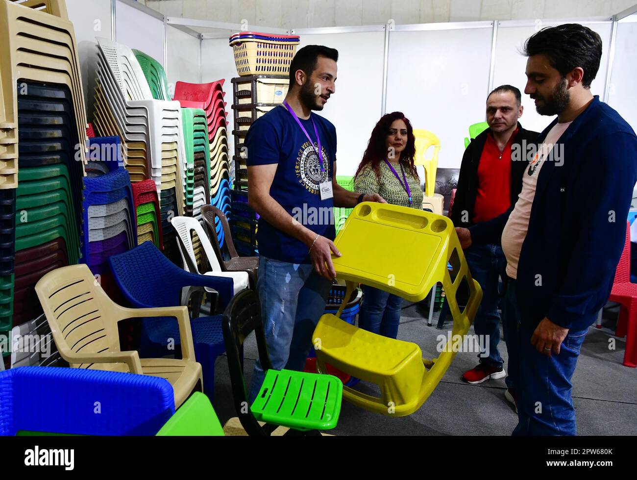 Damascus, Syria. 28th Apr, 2023. An exhibitor shows a product to ...