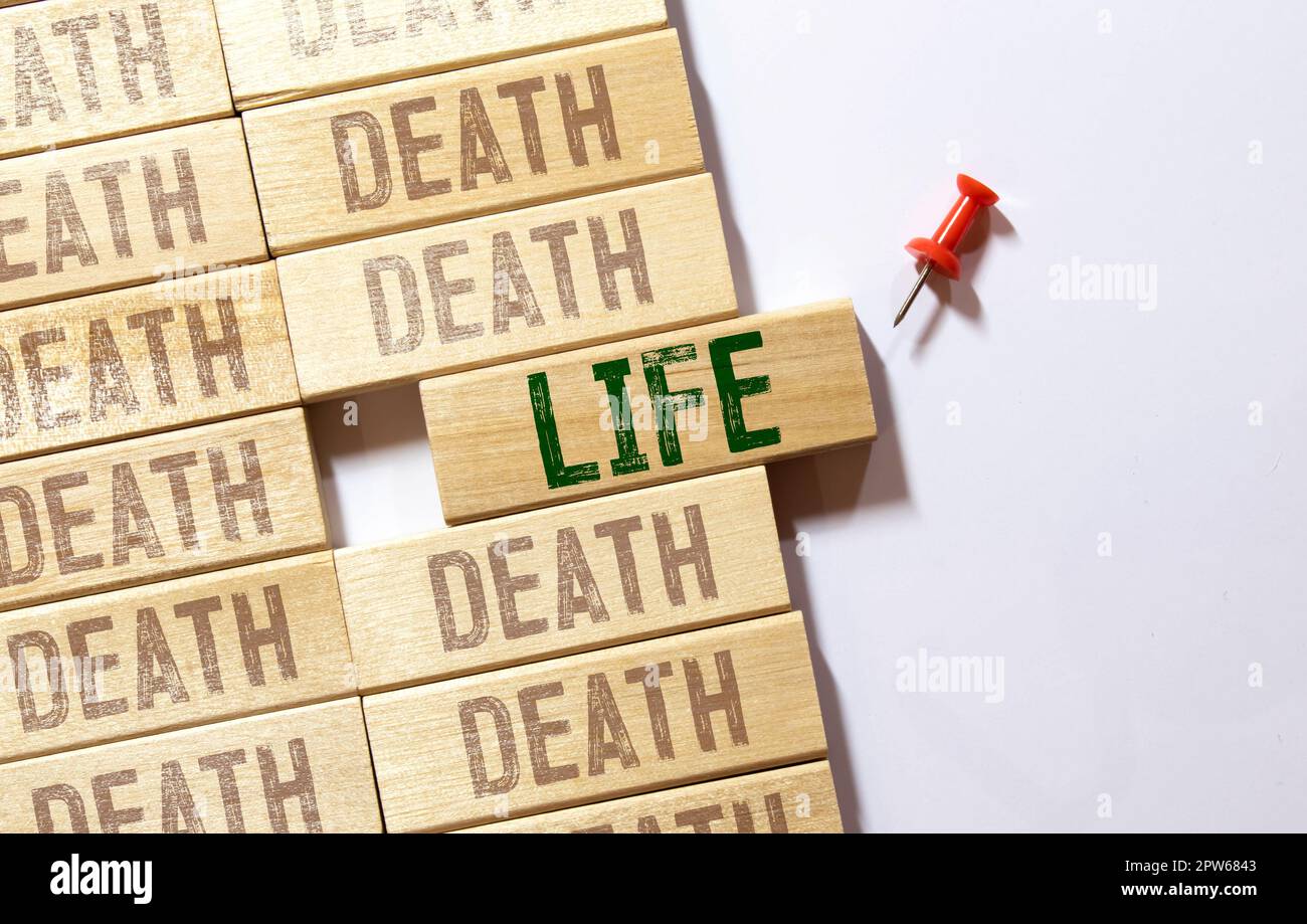 Death and Life words written on two pieces of jigsaw puzzle Stock Photo ...