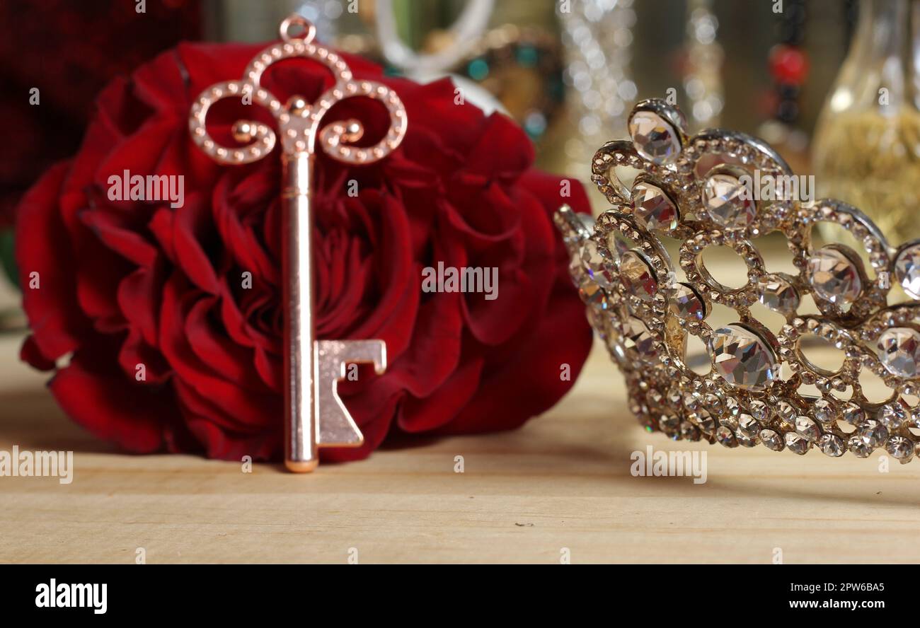 Red Rose with Key and Tiara on Dressing Table Stock Photo - Alamy
