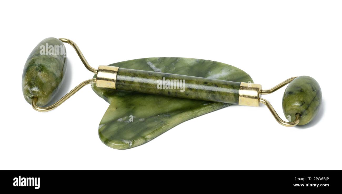 Jade facial massager, an item for cosmetic procedures on a white ...