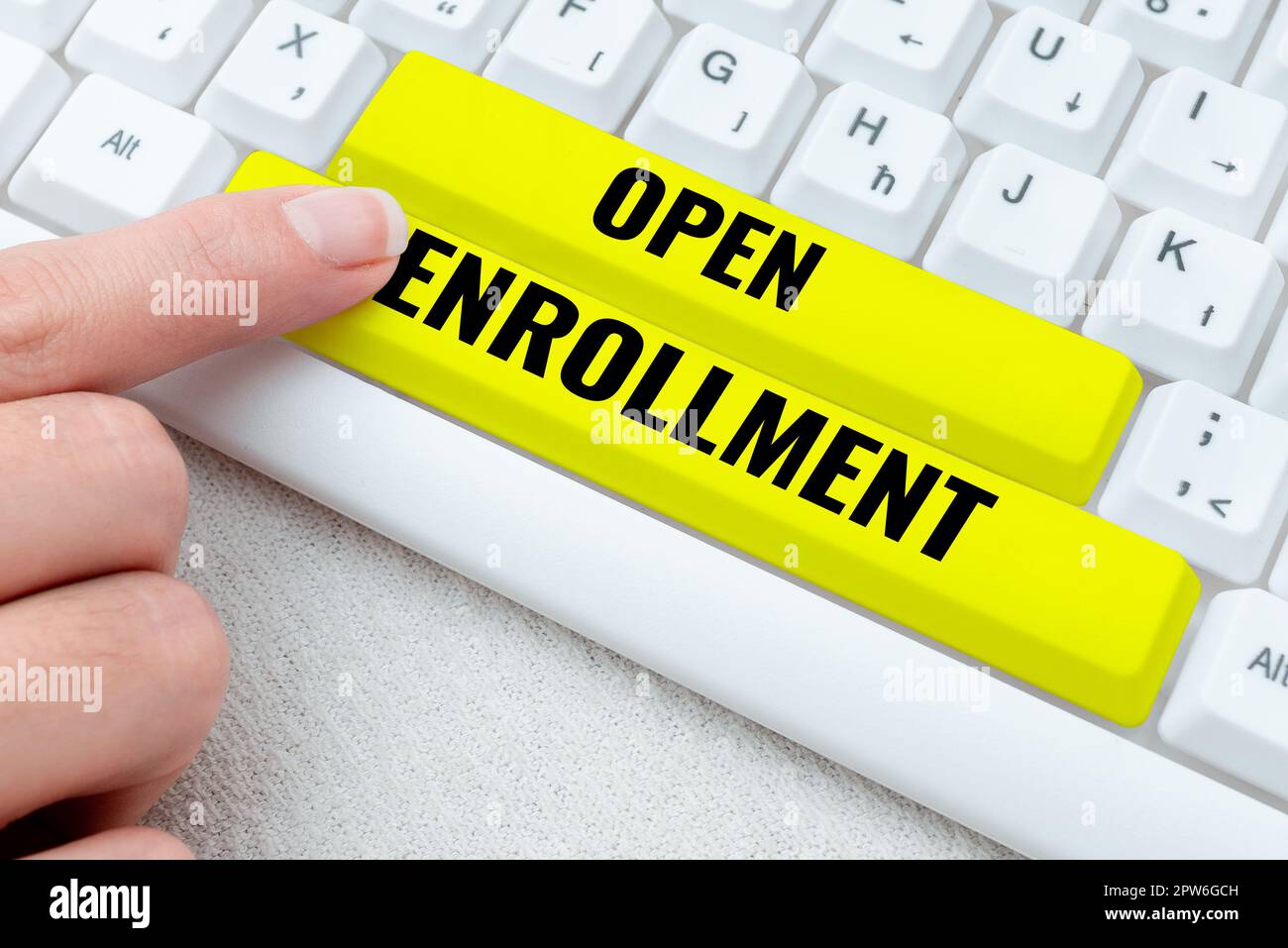 Hand writing sign Open Enrollment, Concept meaning policy of allowing ...