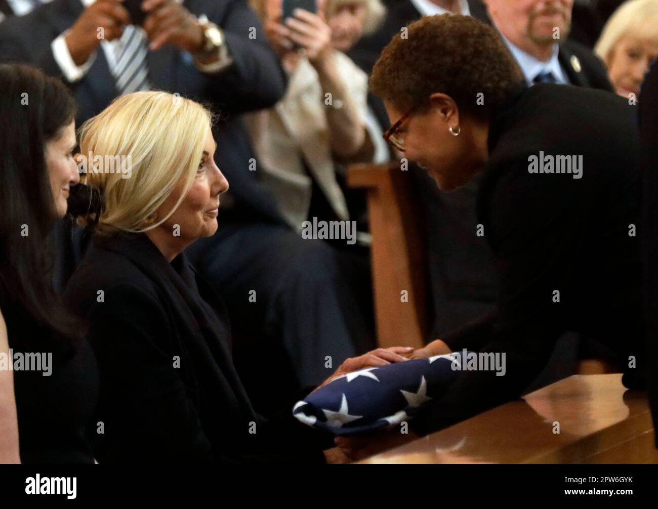 Los Angeles Mayor Karen Bass presents the U.S. flag to Elizabeth ...