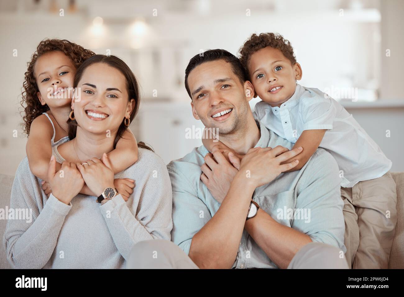 Sharing the love. a young family relaxing together at home Stock Photo ...