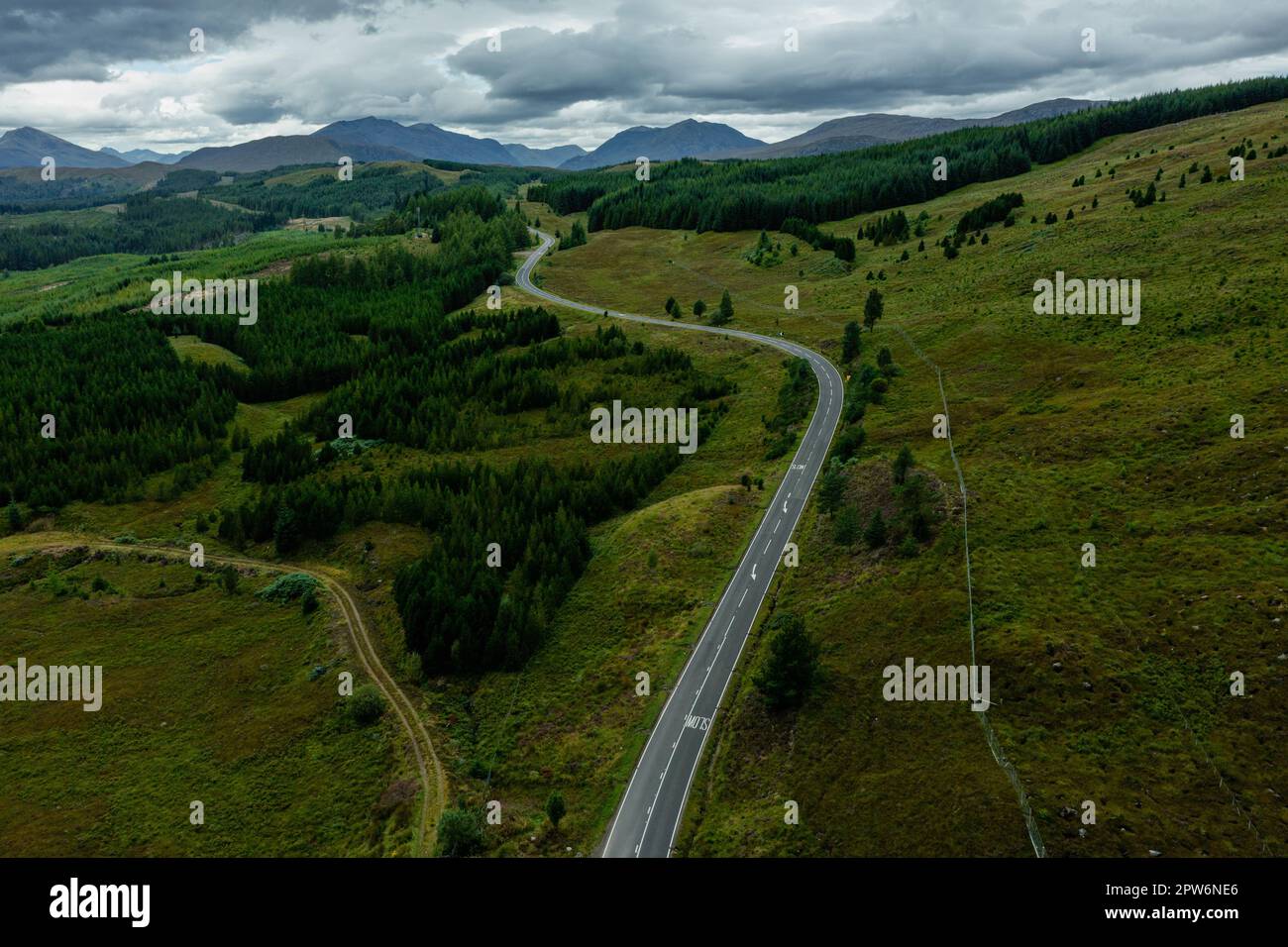 Aerial view of winding road in Scotland. Beautiful and clean nature ...