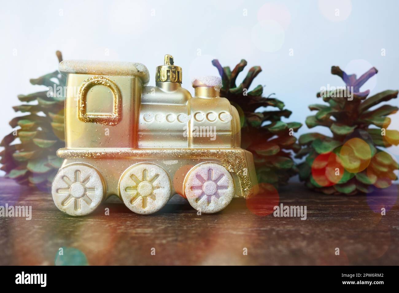 Golden children's toy train. Cones painted with green gouache as small ...