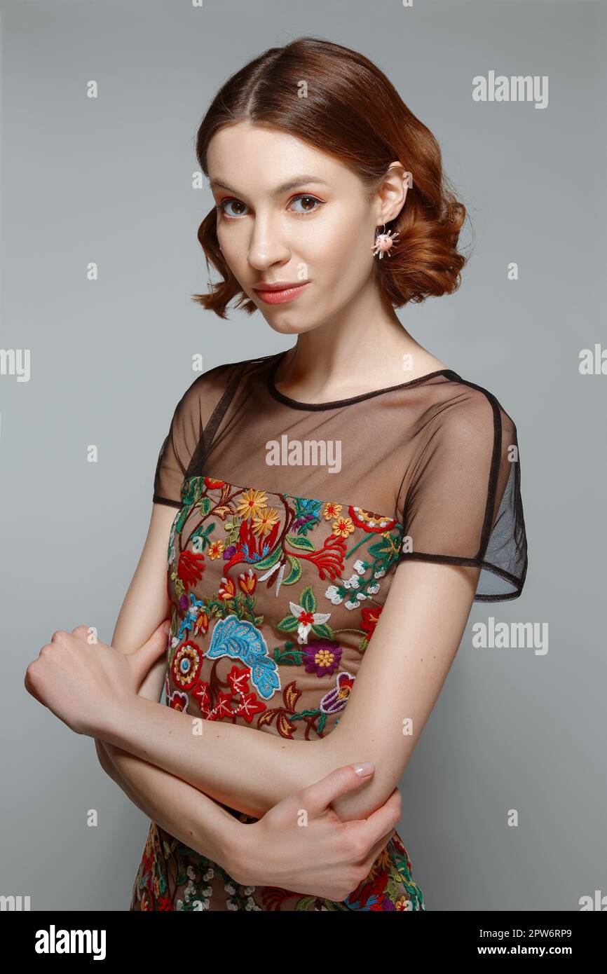 Charming girl in transparent blouse and colorful corset with natural ...