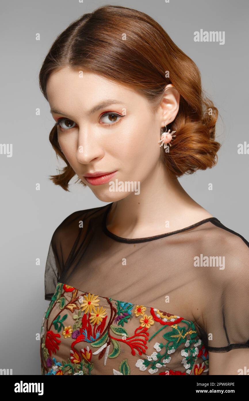 Charming girl in transparent blouse and colorful corset with natural ...