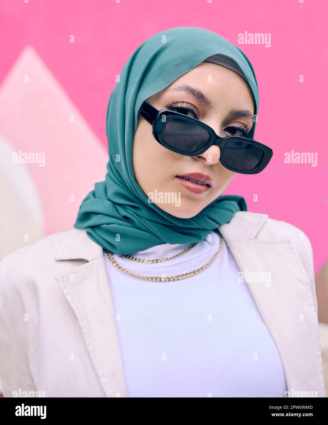 Beautiful young arab woman posing outdoors in a headscarf. Attractive ...