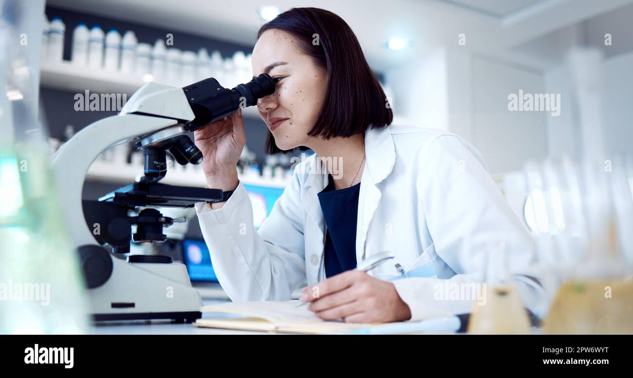 Scientist woman, microscope and lab with writing, book and development ...