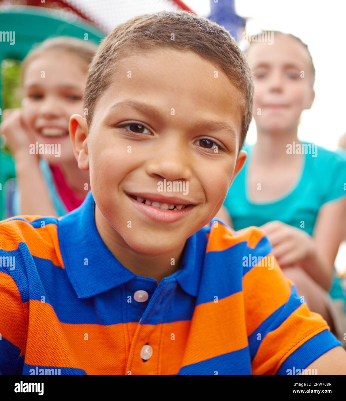 Giving you an innocent smile. A multi-ethnic group of happy children ...