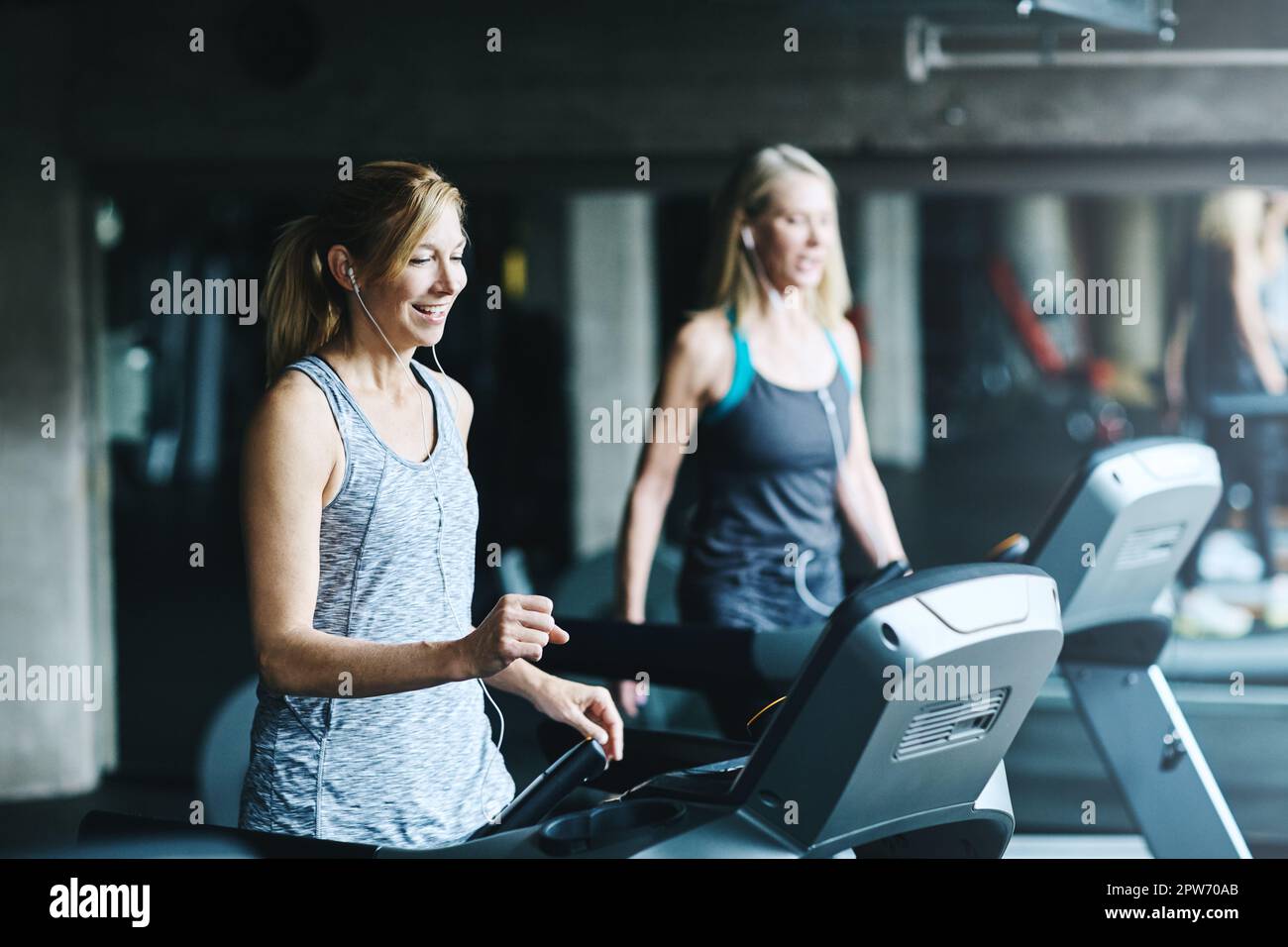 Sweat now, shine later. mature women working out in the gym Stock Photo ...