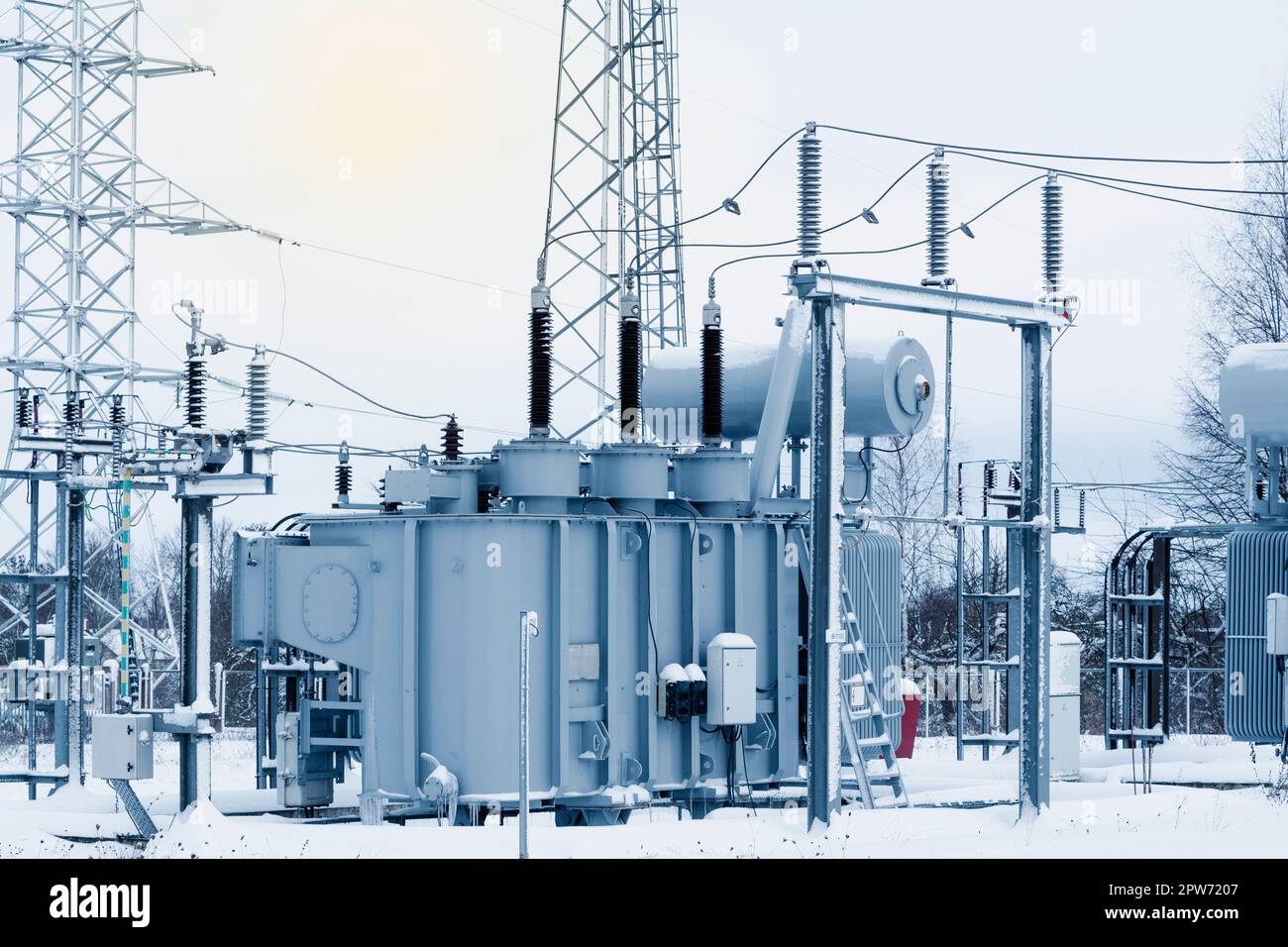 High voltage transformer substation in winter. High voltage equipment ...