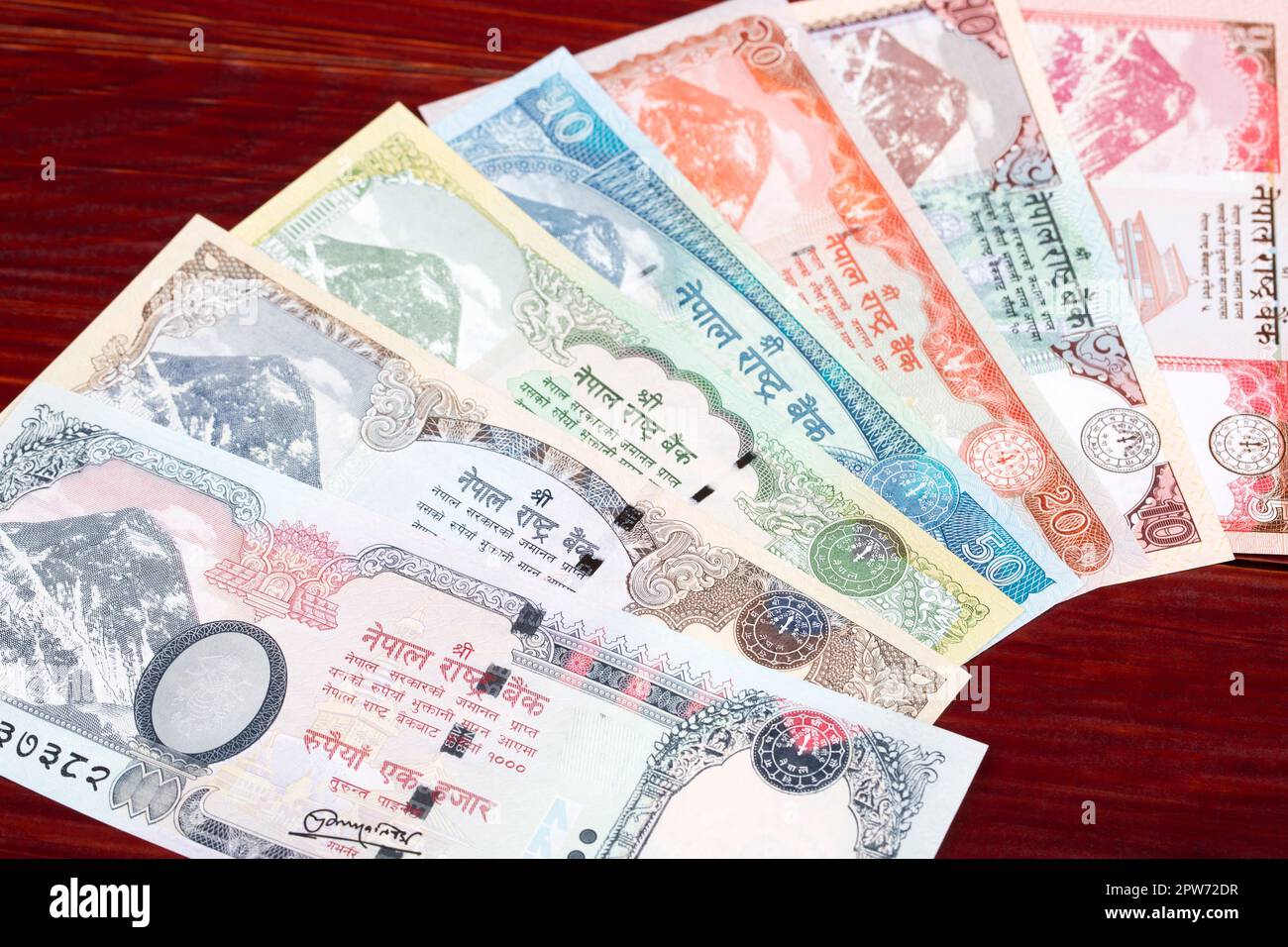 Nepalese money - rupee a business background Stock Photo - Alamy
