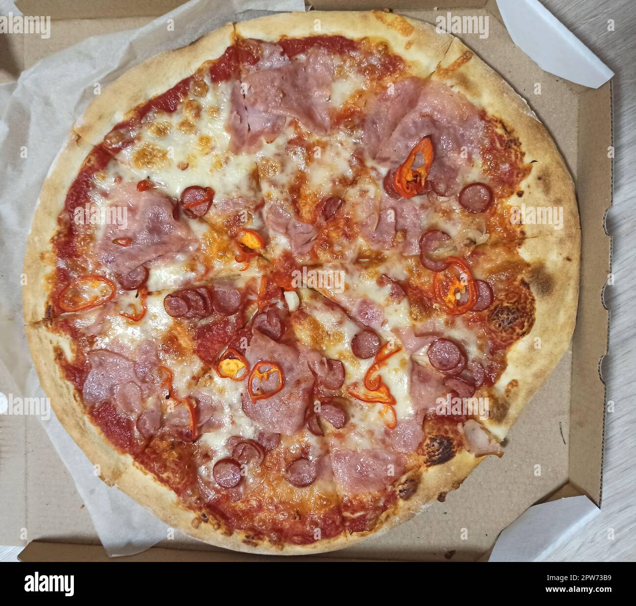 Cut slices of fresh appetizing pizza in box. Piza ready for eating ...