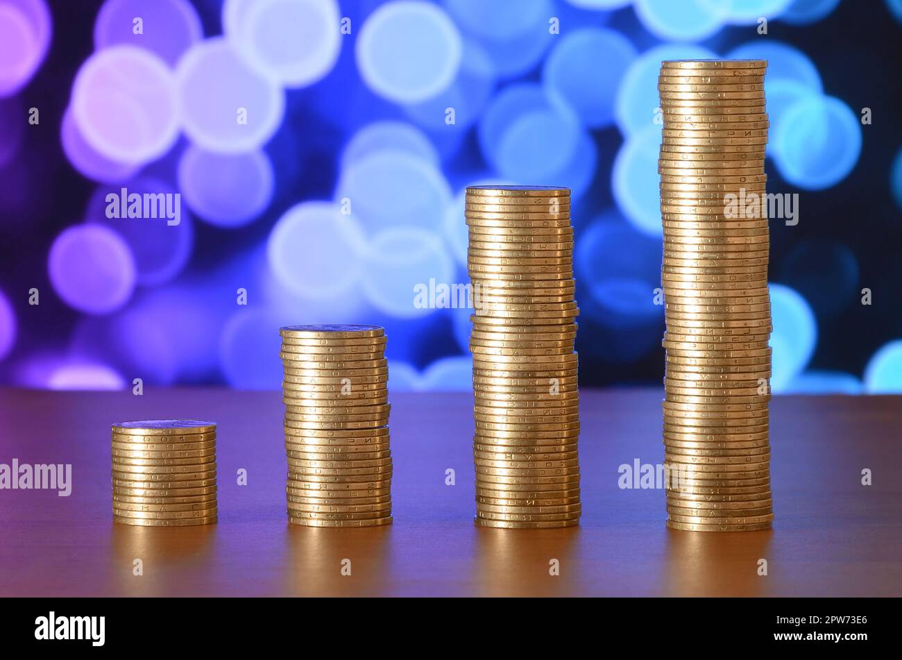 Golden coin stacks arranged as a graph. Increasing columns of coins ...