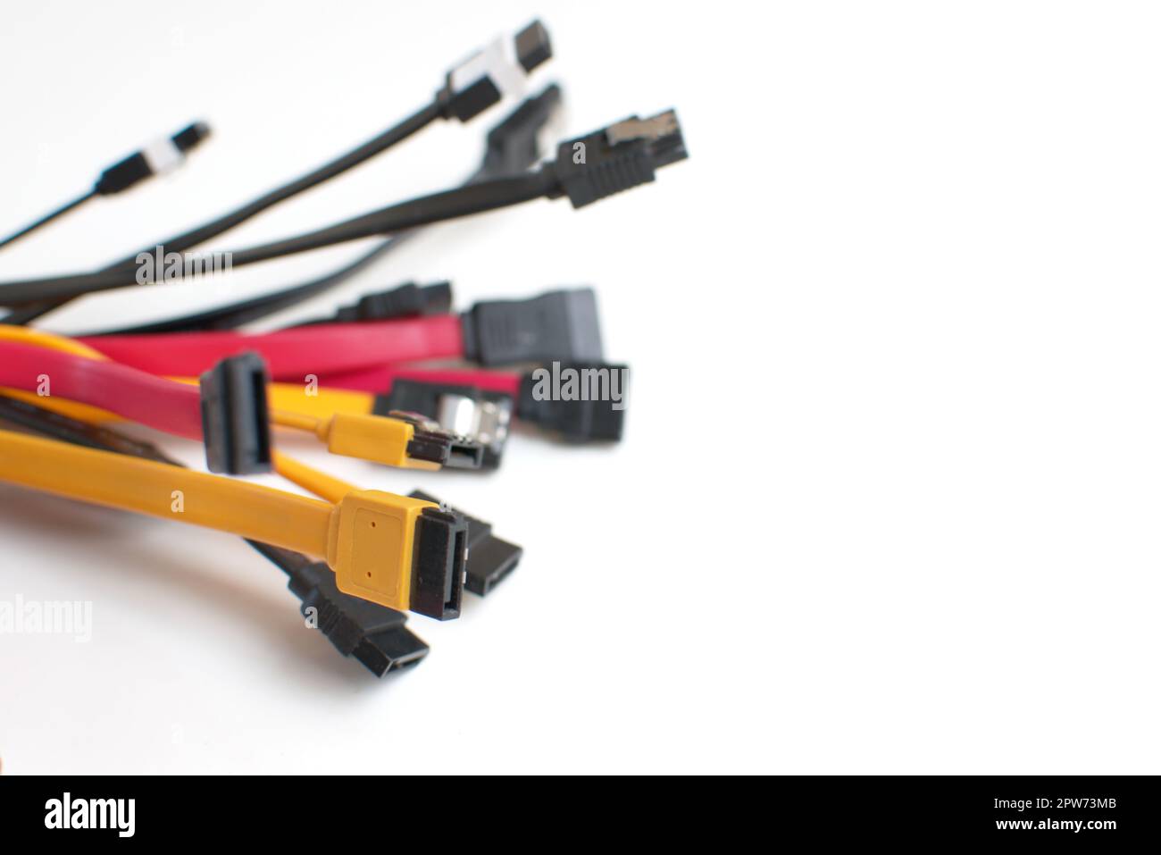 Red, black and yellow data cables on white background. Data storage ...