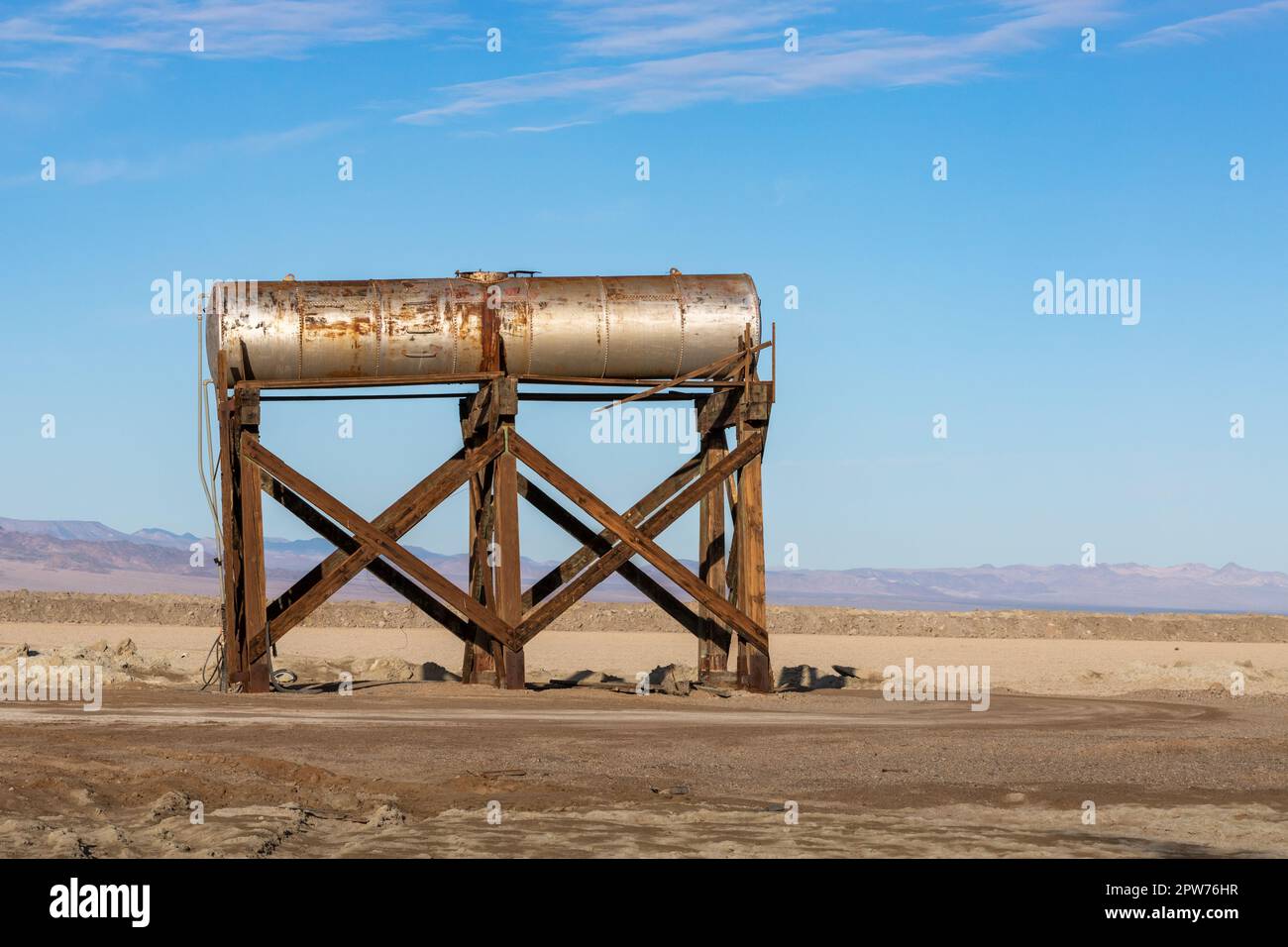 Old and rusty water tank in the empty desert Stock Photo - Alamy