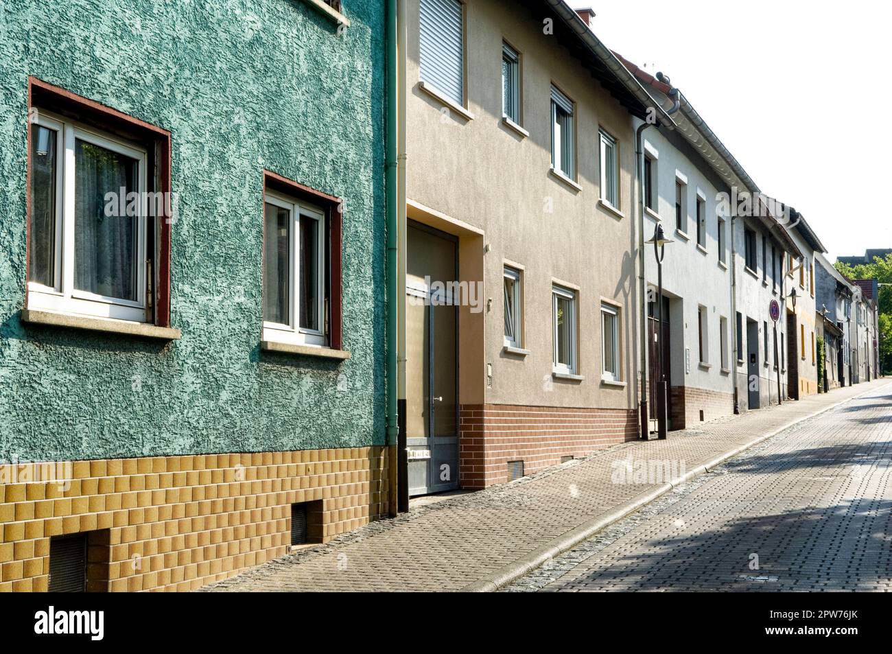 Longitudinal view of a staid row of residential houses in a village in ...