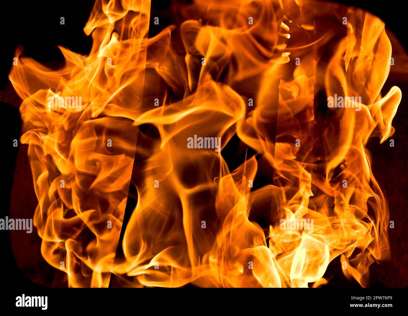 Close up of the orange glowing flames of a blazing fire Stock Photo - Alamy