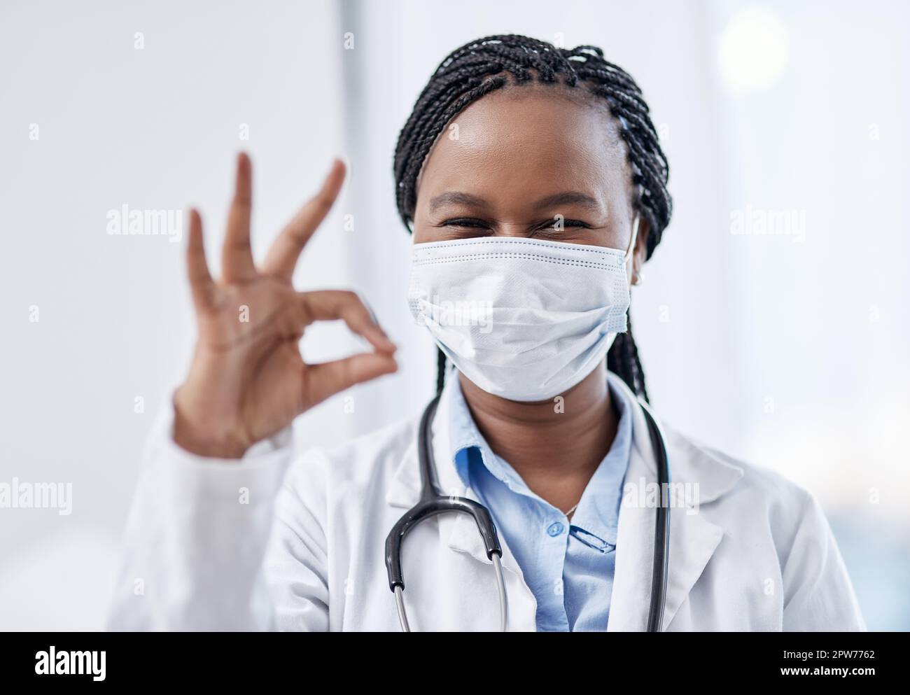 Doctor gesturing okay hand sign, symbol and emoji to express success ...
