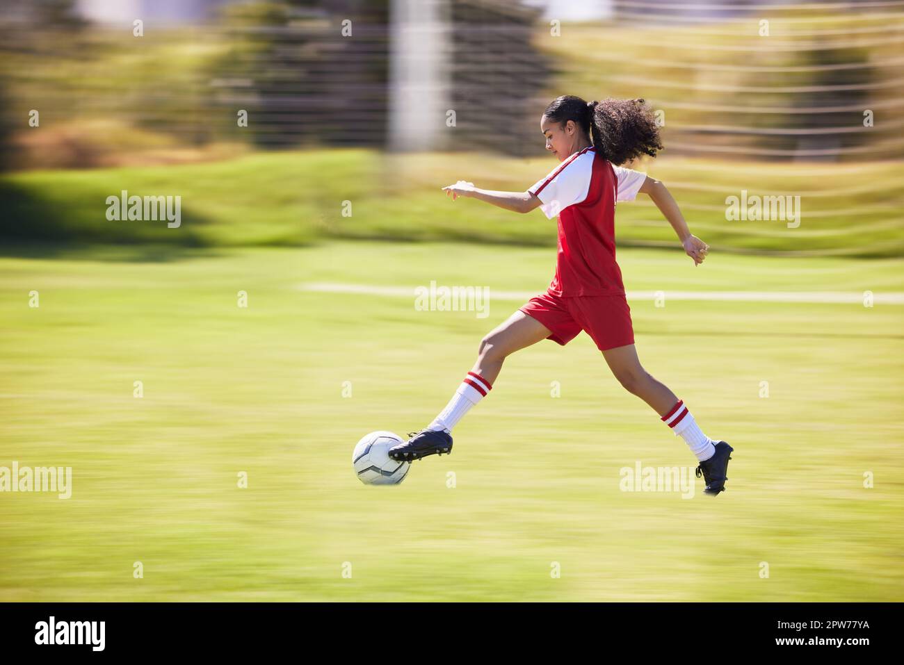 Football, soccer and running girl with a ball doing a sport exercise ...