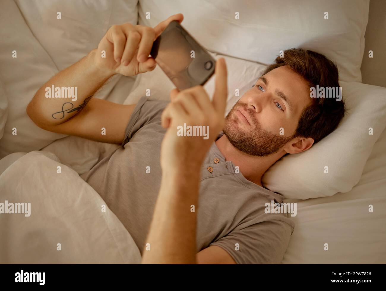 Man relaxing in bed hi-res stock photography and images - Alamy