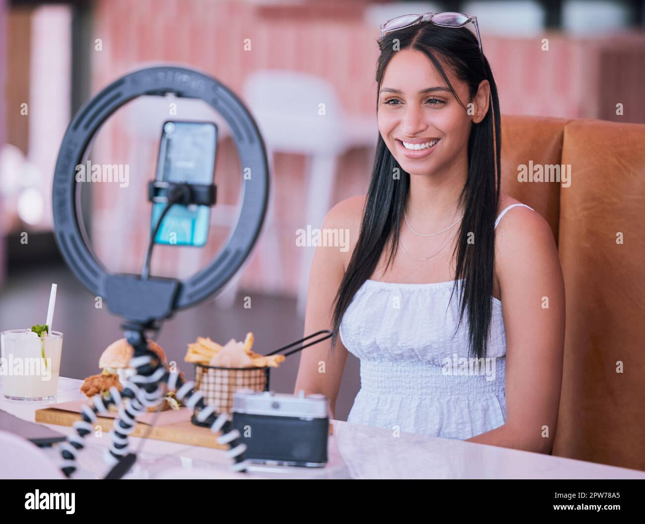 Social media influencer online video of food at cafe, smartphone ...