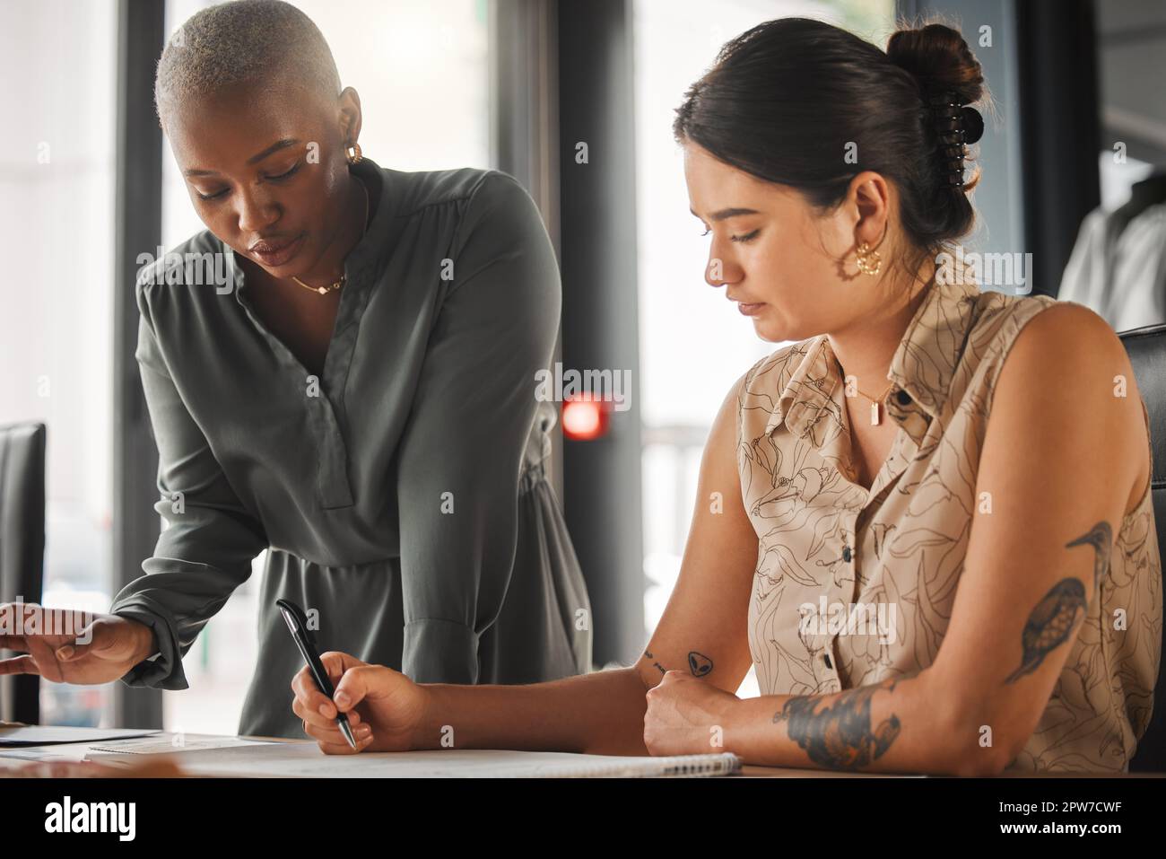 Getting creative with their ideas. two female designers working in an ...