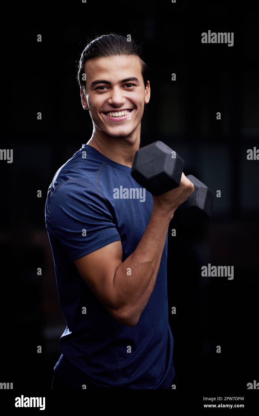 Bodybuilder man, studio portrait and weightlifting with smile for ...
