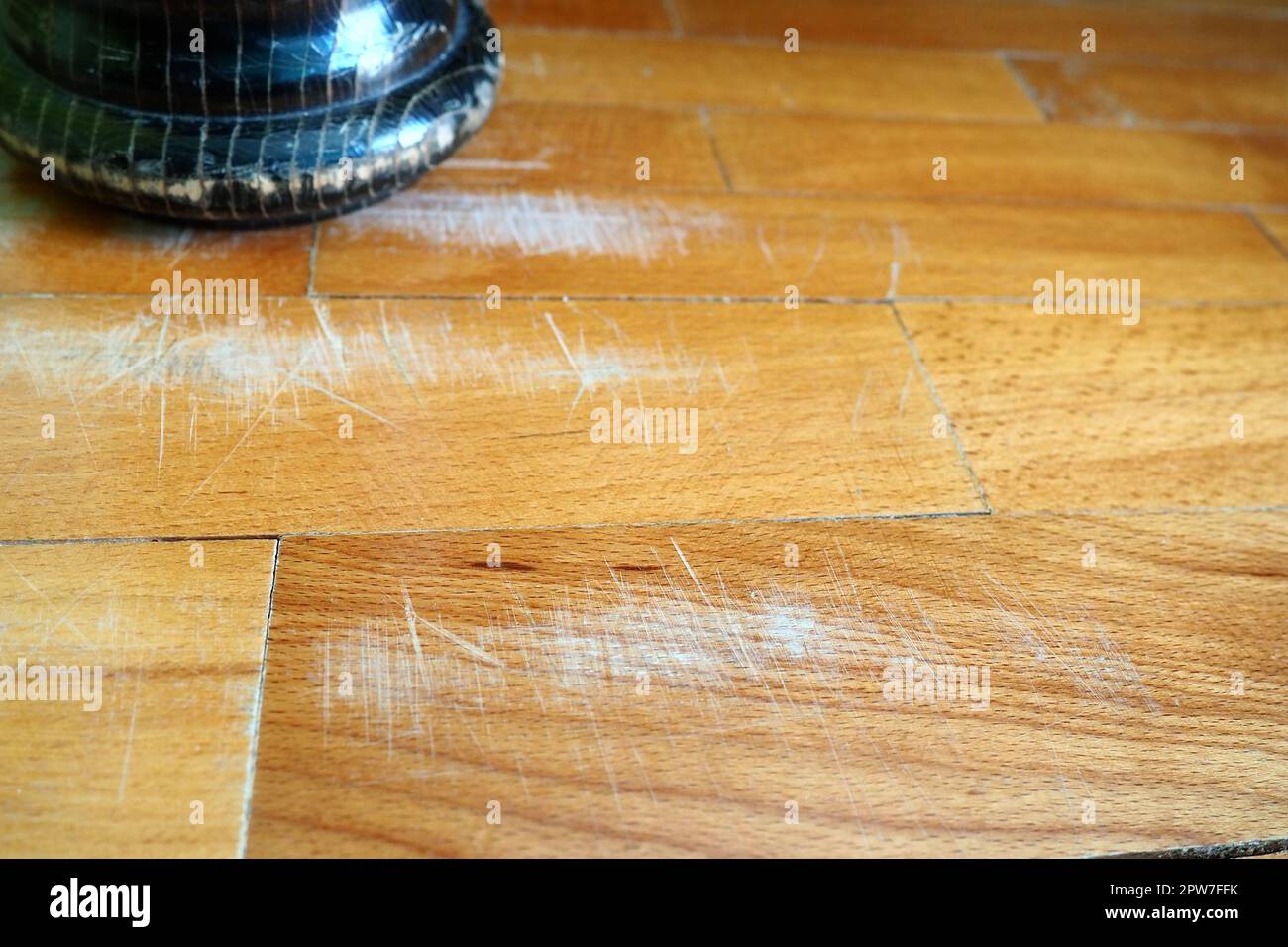 Scratched old parquet flooring needs maintenance. The parquet is ...