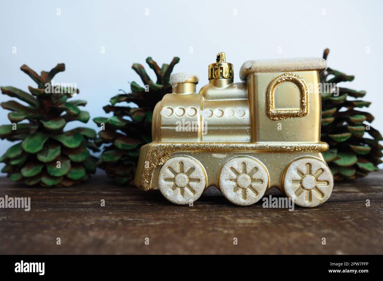 Golden children's toy train. Cones painted with green gouache like ...