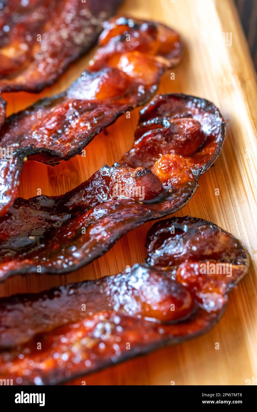Fried bacon strips glazed in brown sugar Stock Photo - Alamy