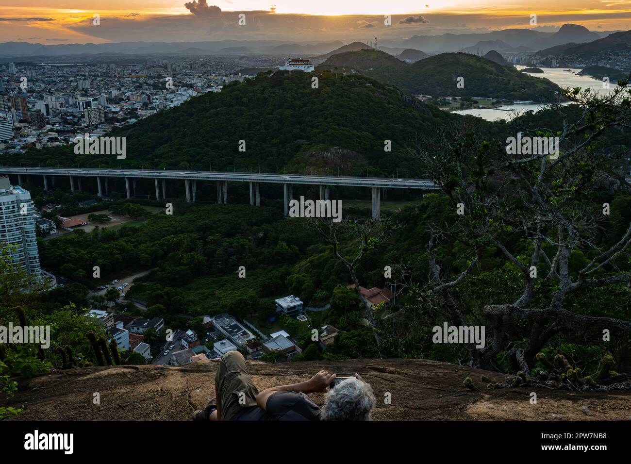 Photograph of the Penha Convent at sunset, also showing the cities of ...