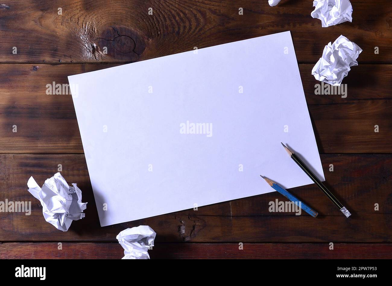 Photo of a clean white blank sheet of paper lie on a brown wooden ...